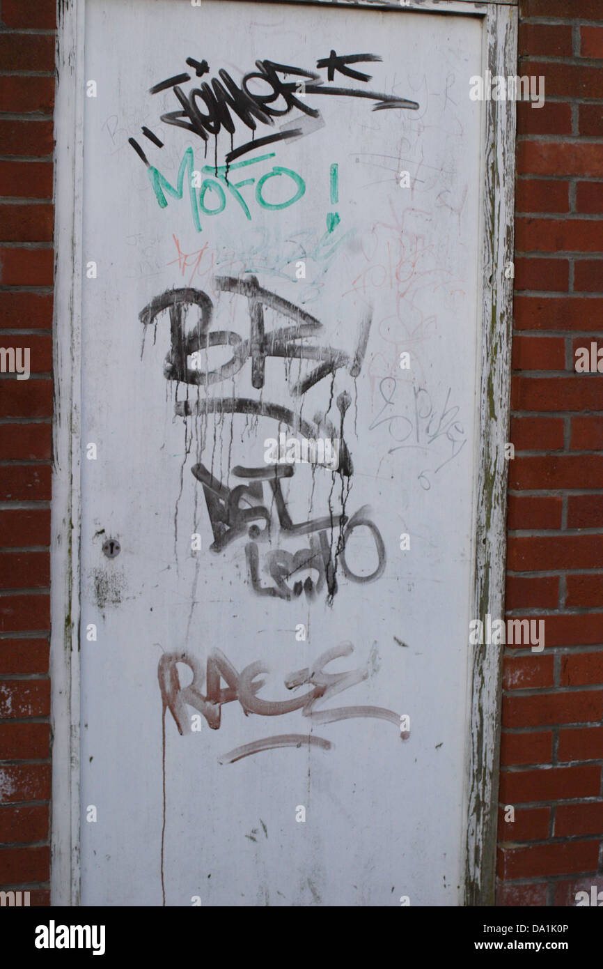 dirty Wooden Back Gate with spray painted grafitti, lots of graffiti in ...