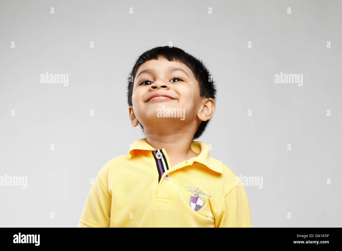 Little Indian kid is giving happy expression Stock Photo - Alamy