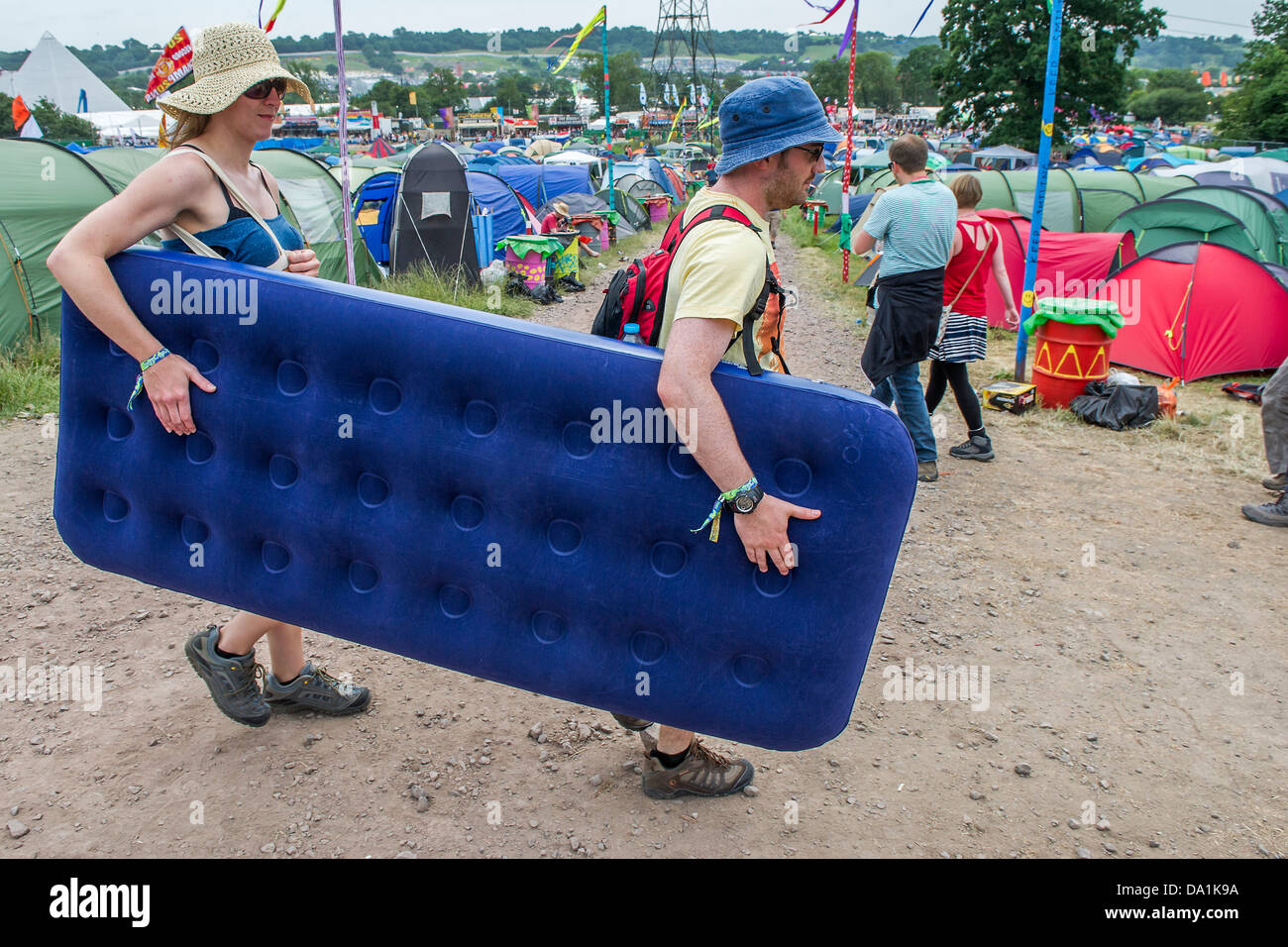 Arrivals - the sun soon fades and the rain starts. People bring ...