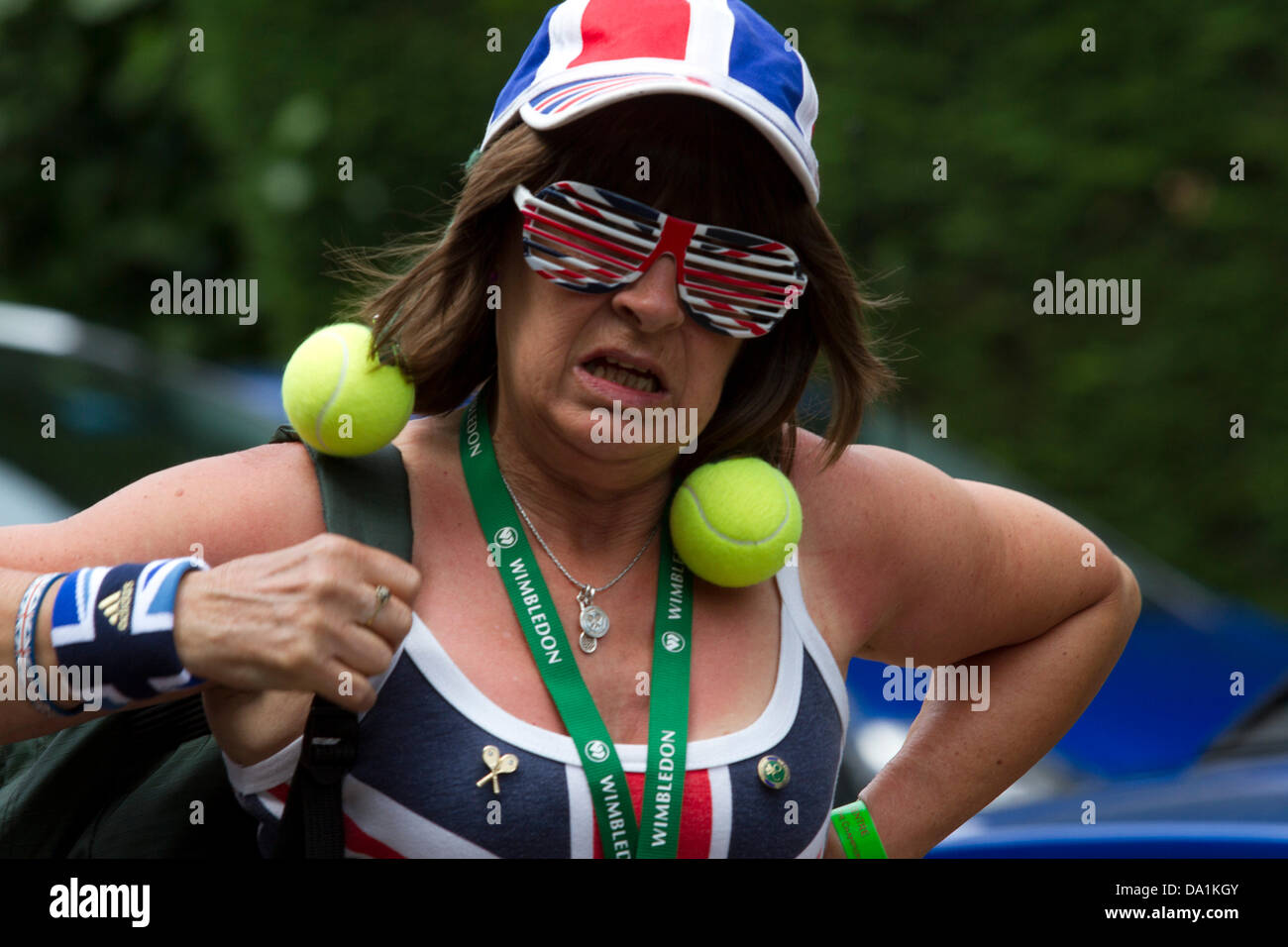 Wimbledon, London, UK. 1st July, 2013. A tennis fan wearing tennis ...