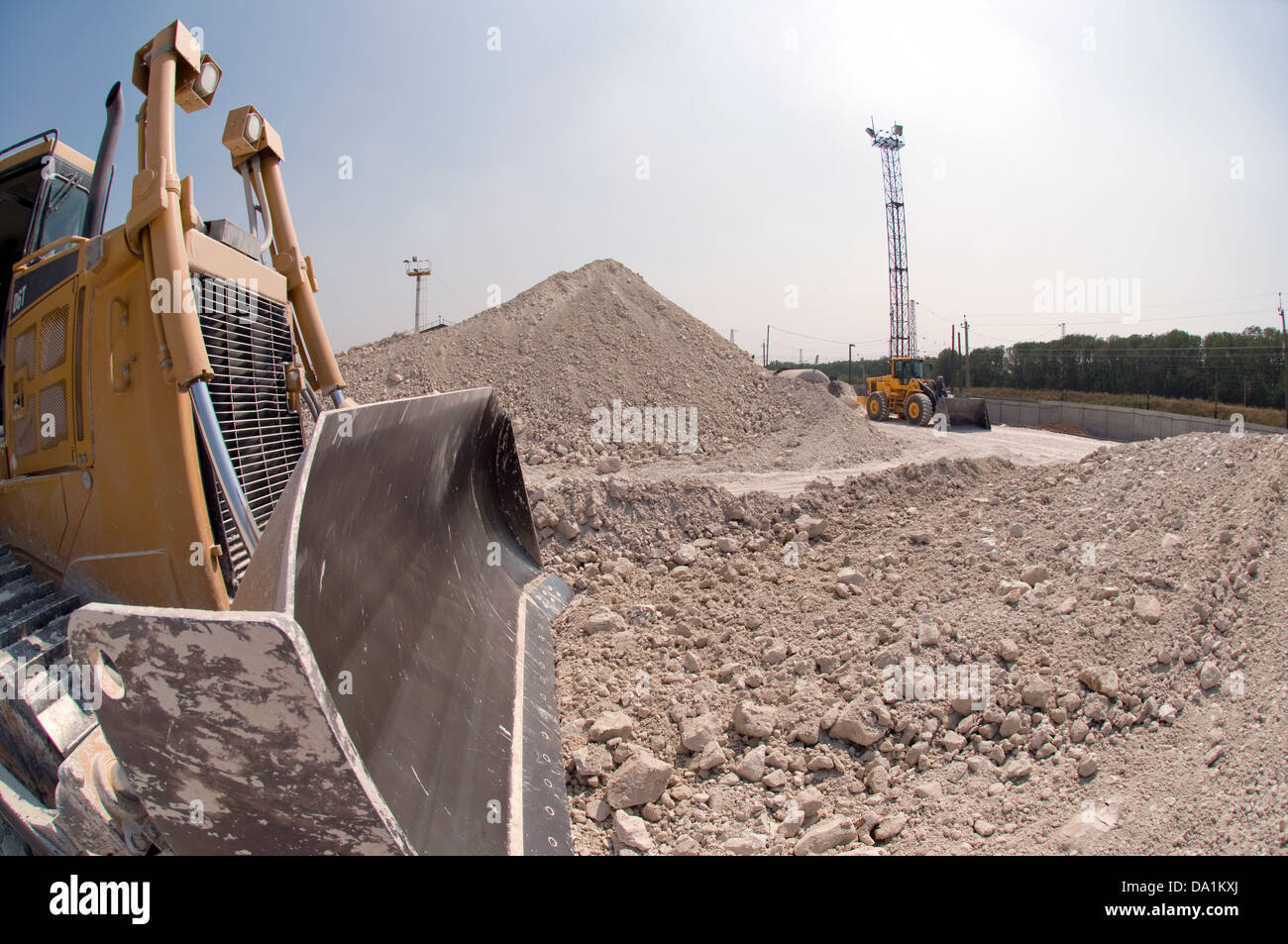 loading machine produces crushed stone for a career Stock Photo - Alamy