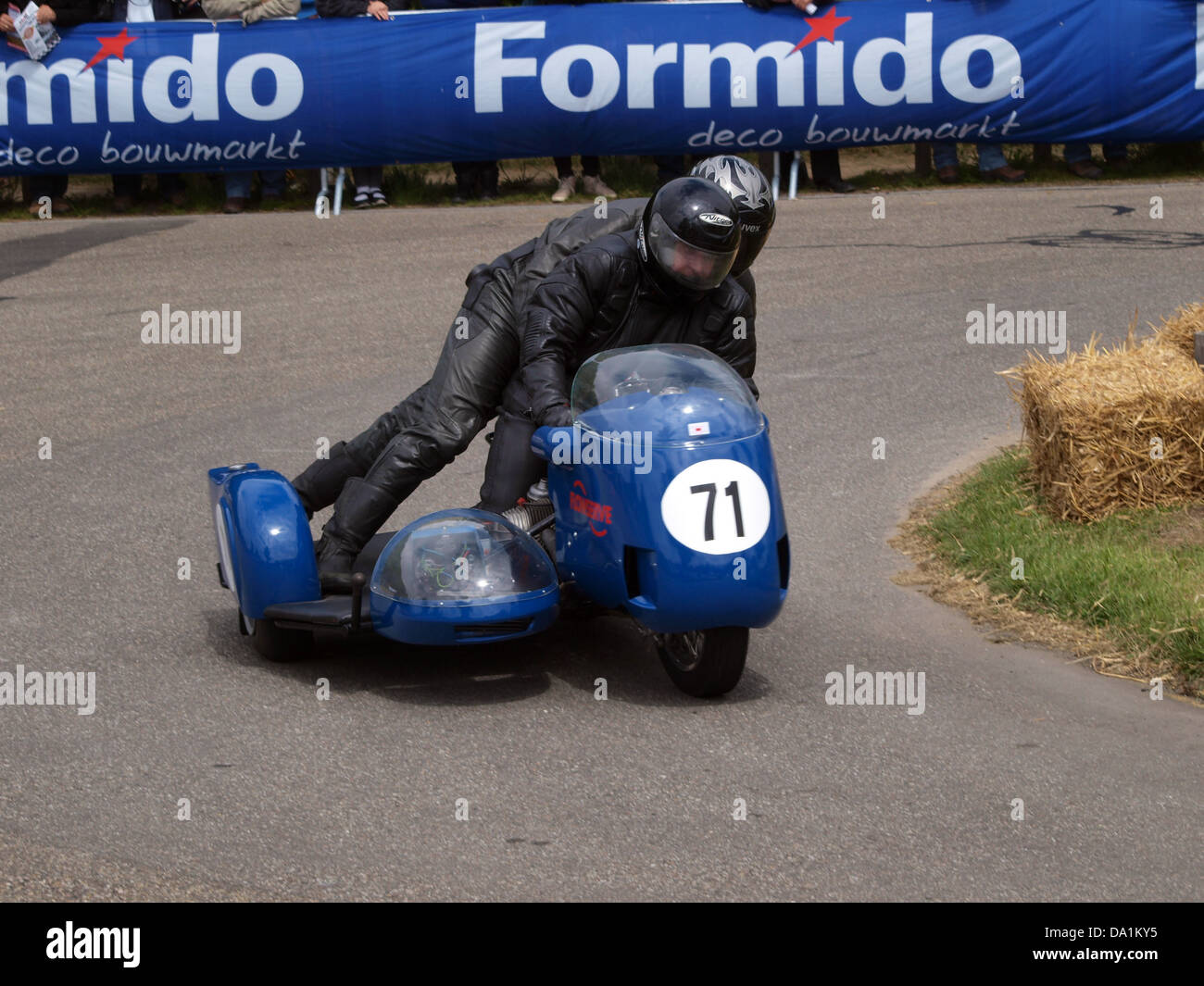 A 16th image of a BMW motorcycle and sidecar combination, number 71 ...