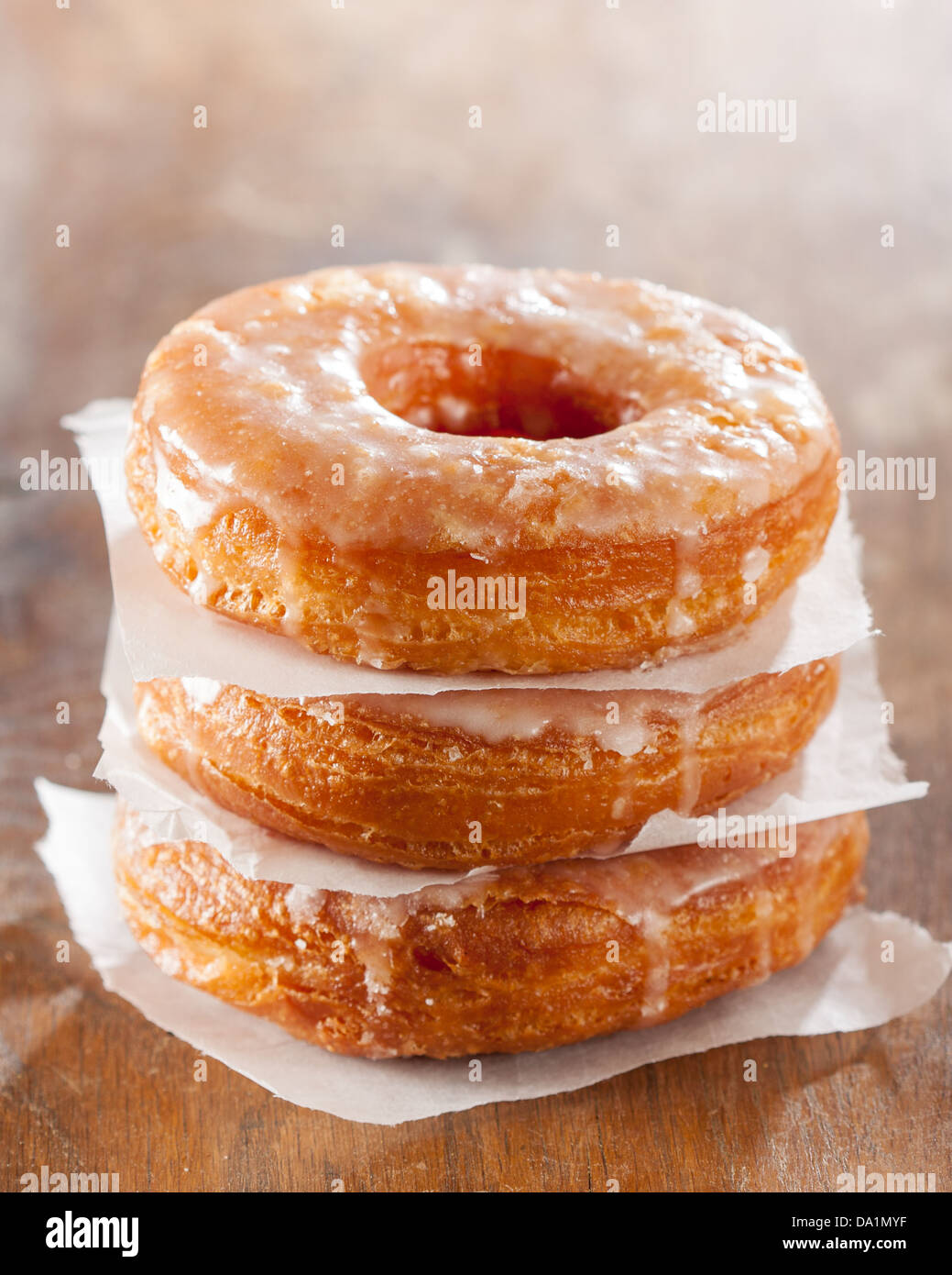 Croissant and doughnut mixture pile on a wooden table Stock Photo - Alamy