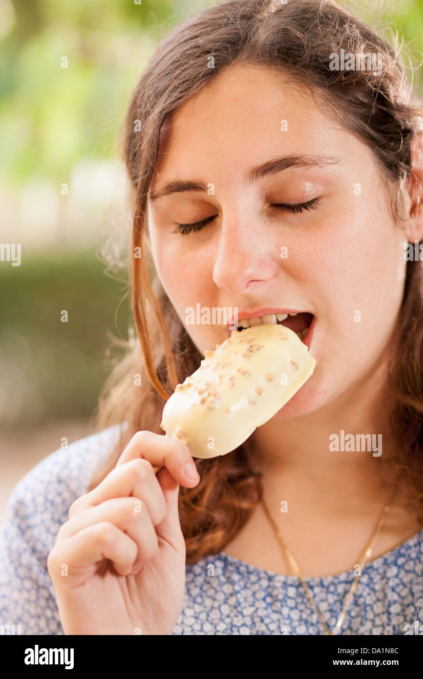 Girl eating chocolate ice cream hi-res stock photography and images - Alamy