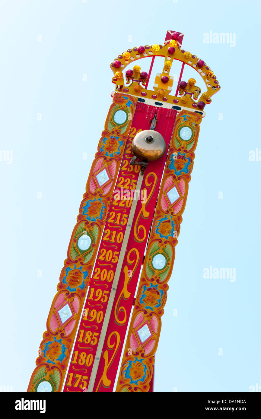 high striker, also known as a strength tester, or strongman game at a ...