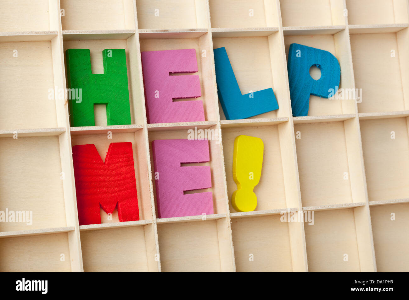 Wooden letter blocks forming the words HELP ME! Stock Photo - Alamy