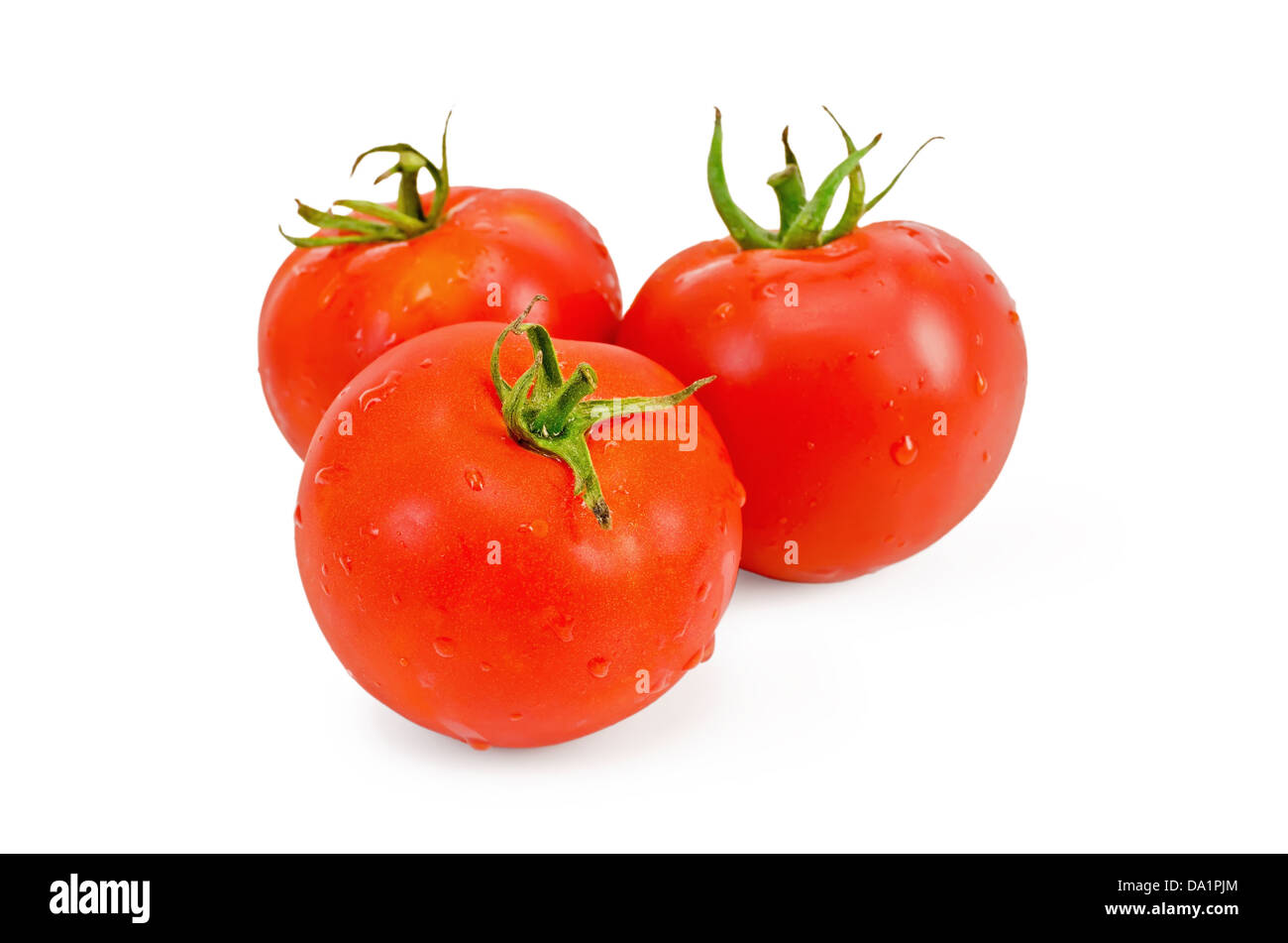 Three red tomatoes whole with water drops isolated on white background ...