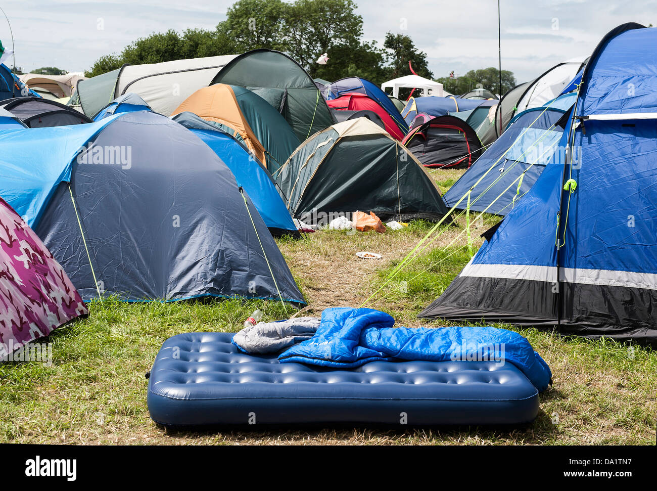 Arrivals - the sun soon fades and the rain starts. People bring ...