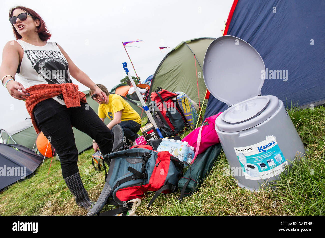 Arrivals - the sun soon fades and the rain starts. People bring ...