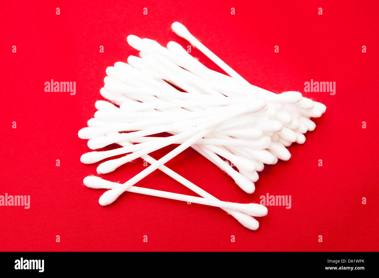 ear sticks on a red background Stock Photo - Alamy