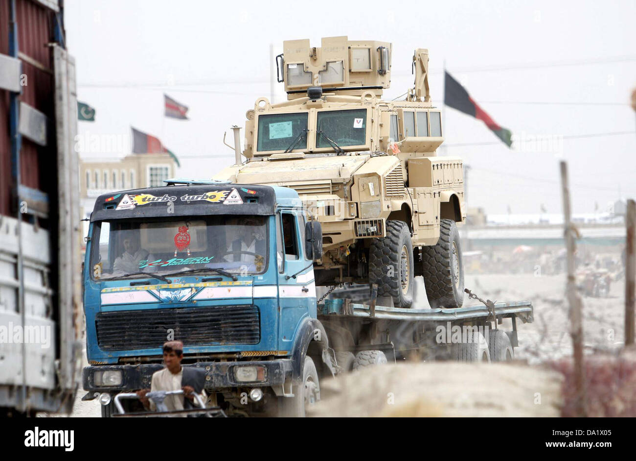 Trucks carrying US military equipments coming from Kandahar crossing ...