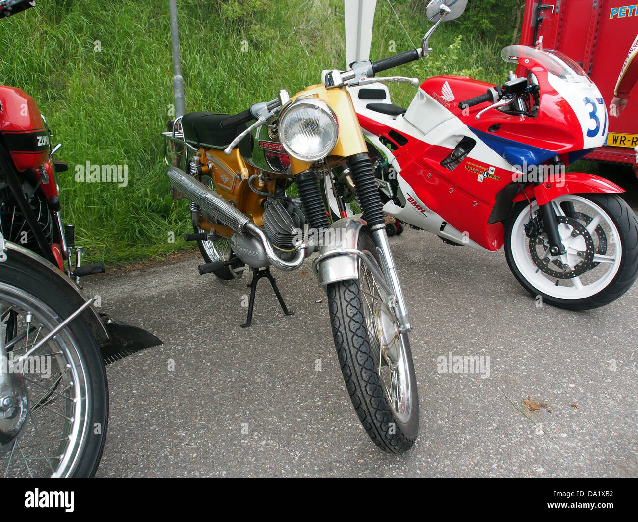 A golden-colored Zundapp motorcycle from the mid-20th century is ...