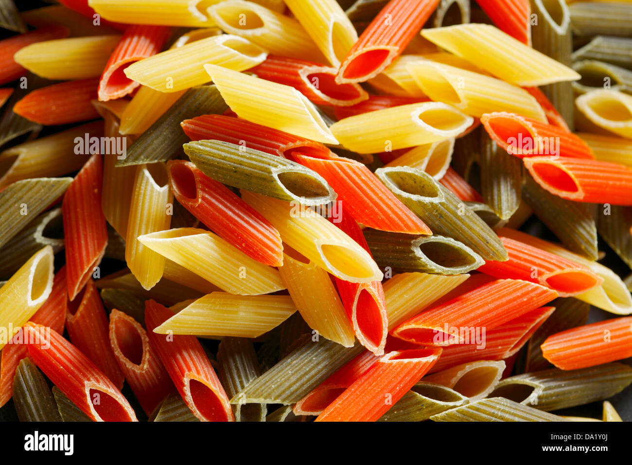 Colored dry italian pasta background Stock Photo - Alamy