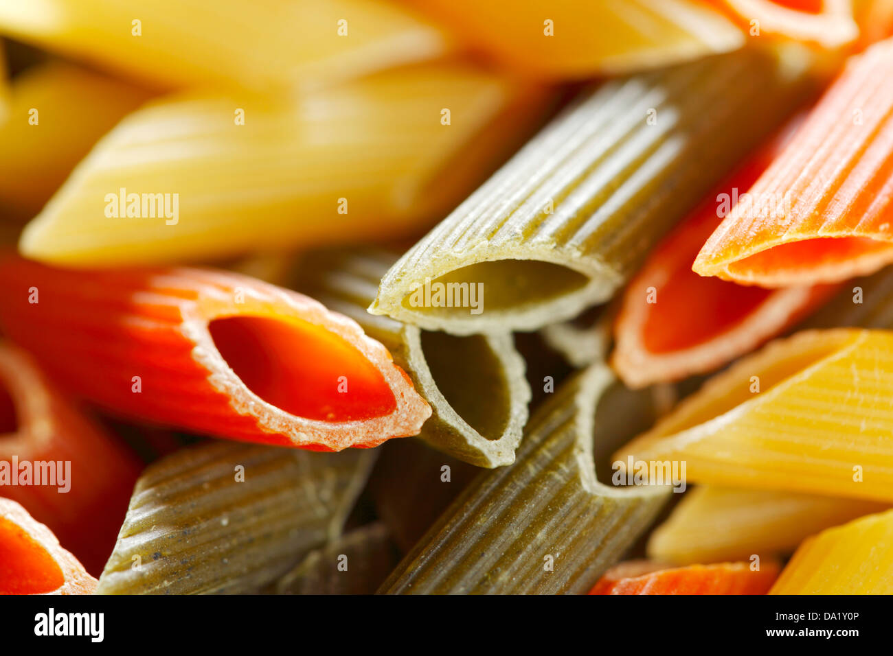 Colored dry italian pasta background Stock Photo - Alamy