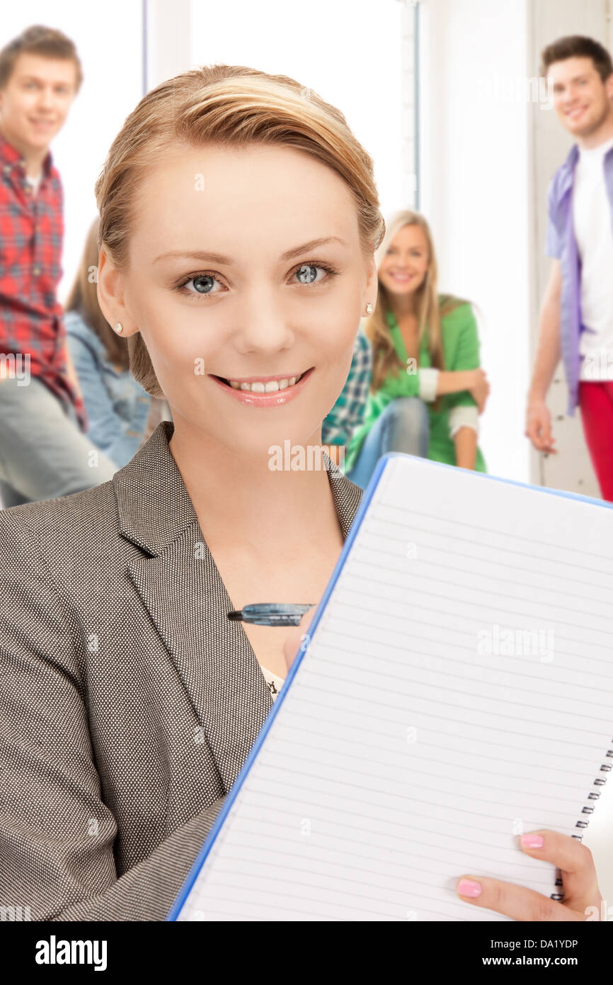 teacher with big notepad at school Stock Photo - Alamy