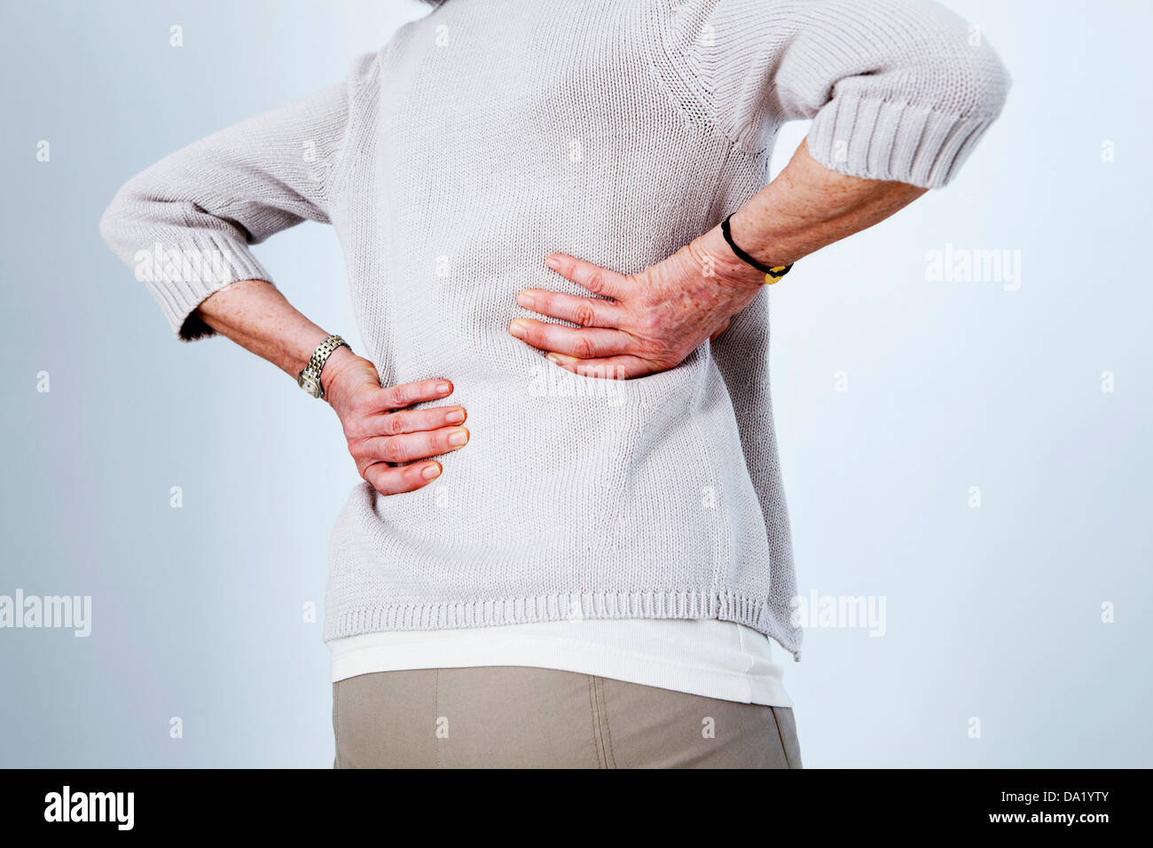 LOWER BACK PAIN IN ELDERLY PERSON Stock Photo - Alamy
