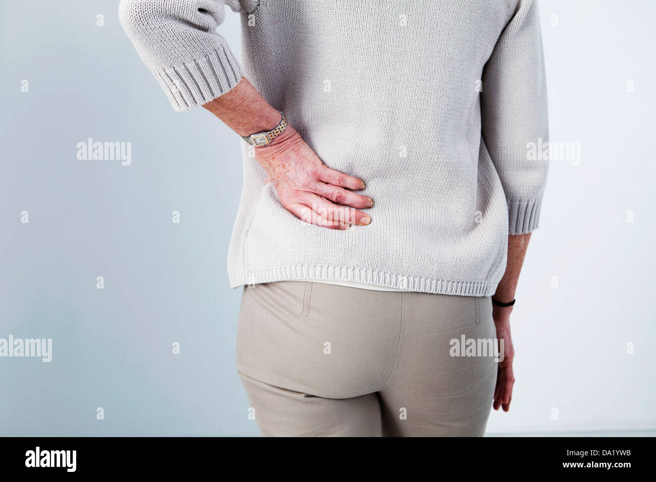LOWER BACK PAIN IN ELDERLY PERSON Stock Photo - Alamy
