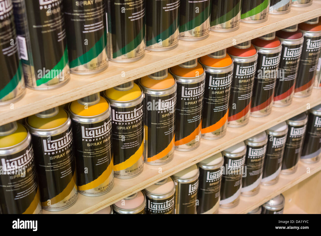 Unprotected except by a surveillance camera, aerosol cans of paint are ...