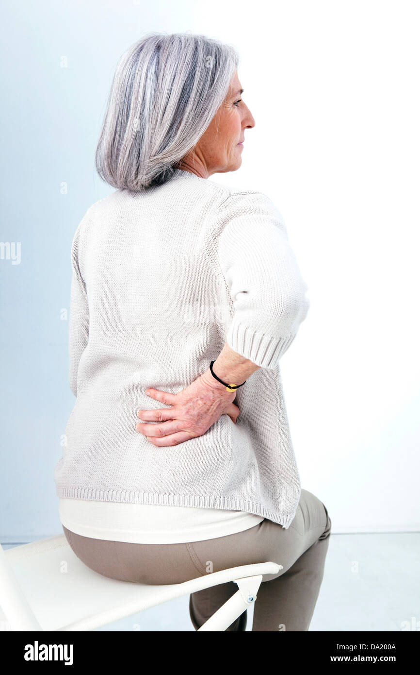 LOWER BACK PAIN IN ELDERLY PERSON Stock Photo - Alamy