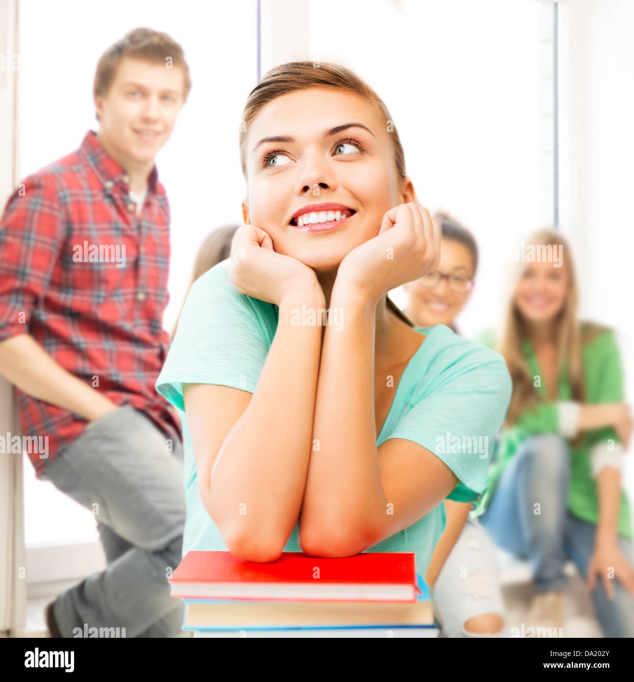 happy smiling student girl with books at school Stock Photo - Alamy