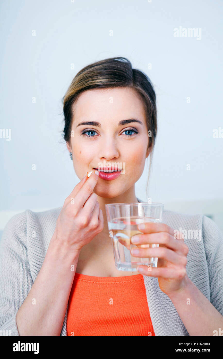WOMAN TAKING MEDICATION Stock Photo - Alamy