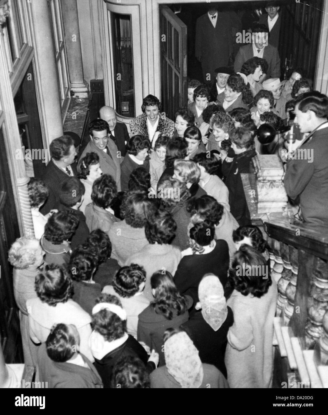 FRANKIE VAUGHAN (1928-1999) UK pop singer surrounded by fans about 1958 ...