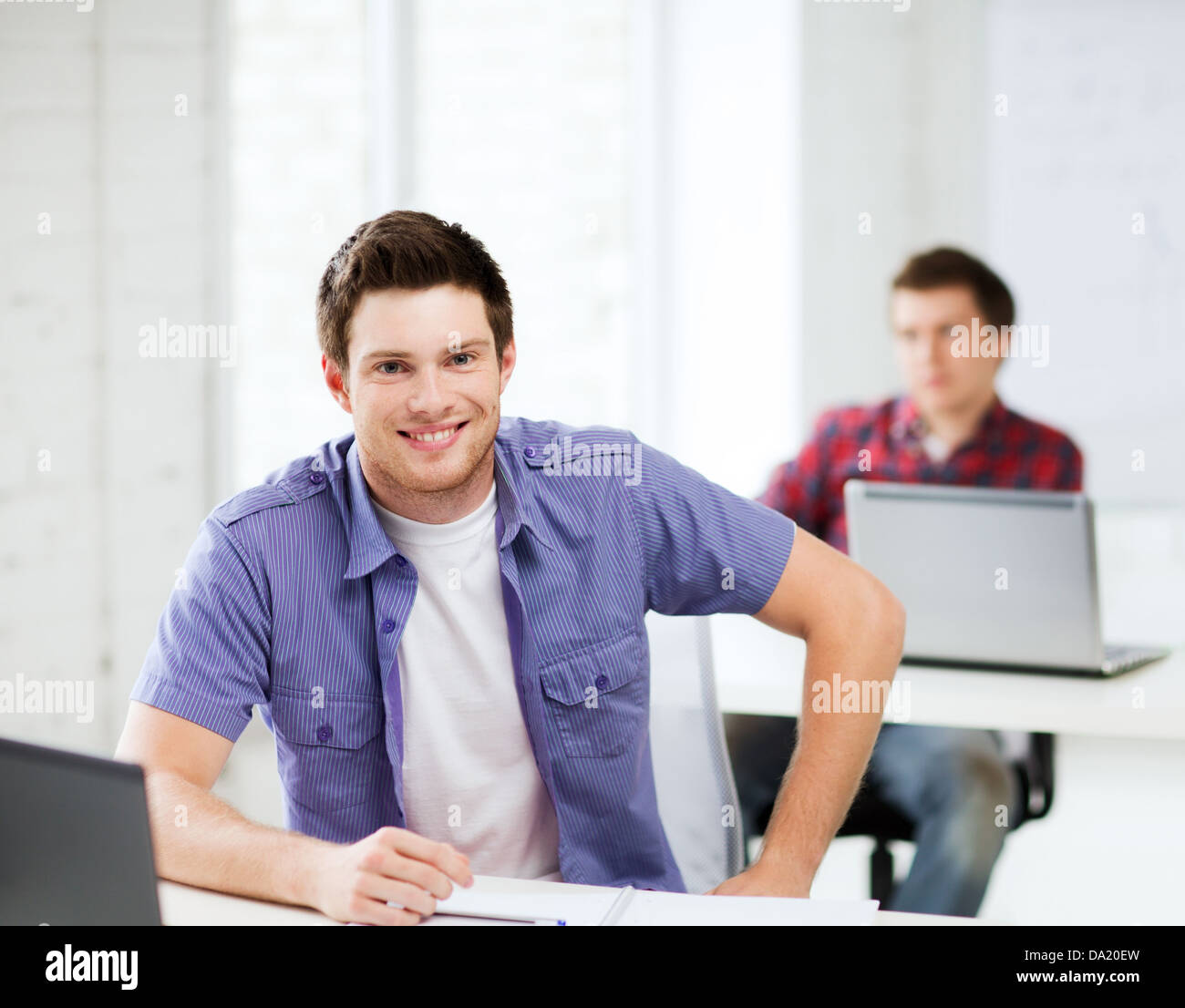 smiling student with laptop at school Stock Photo - Alamy