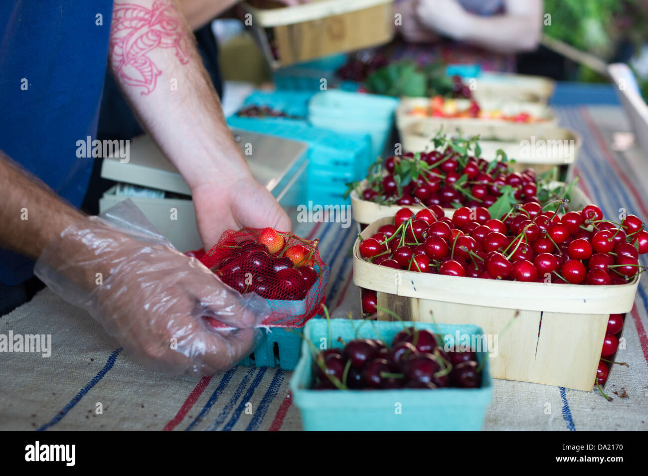 Sweet cherries in baskets stands hi-res stock photography and images ...