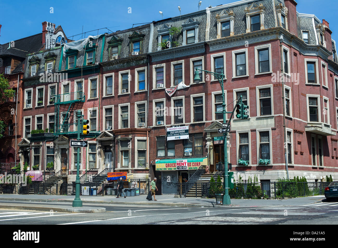 A group of buildings with retail on the first floor on a block in the ...