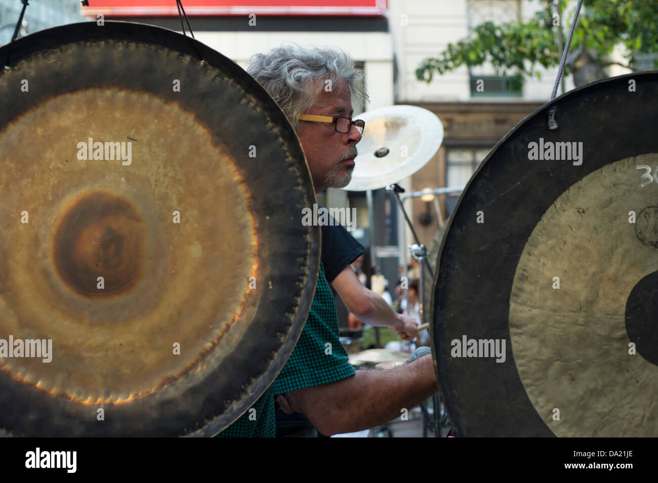 Gong players perform in Herald Square in New York as part of Mass ...