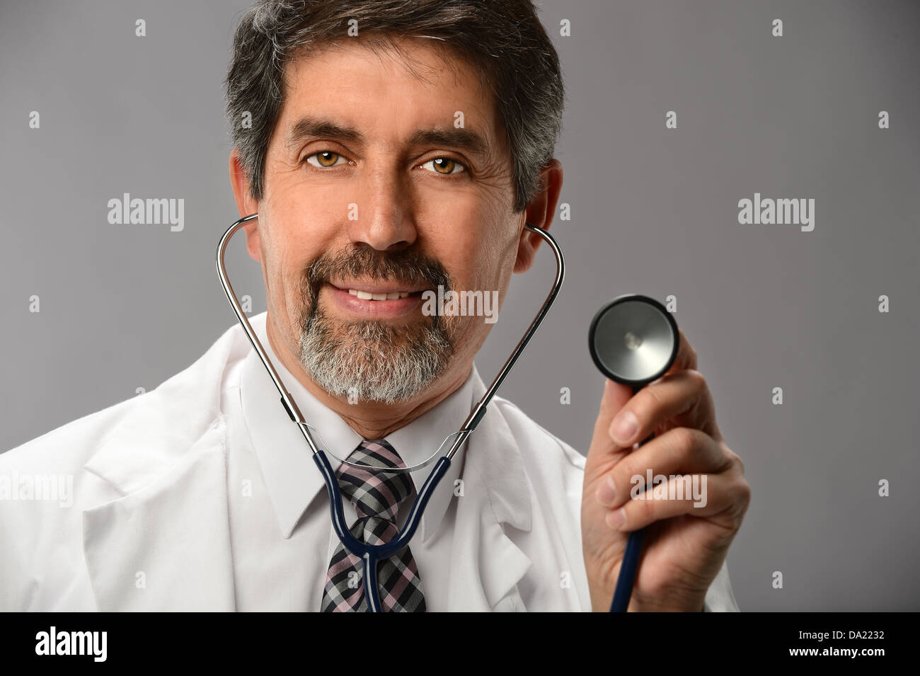 Portrait of Hispanic doctor using stethoscope in office Stock Photo - Alamy
