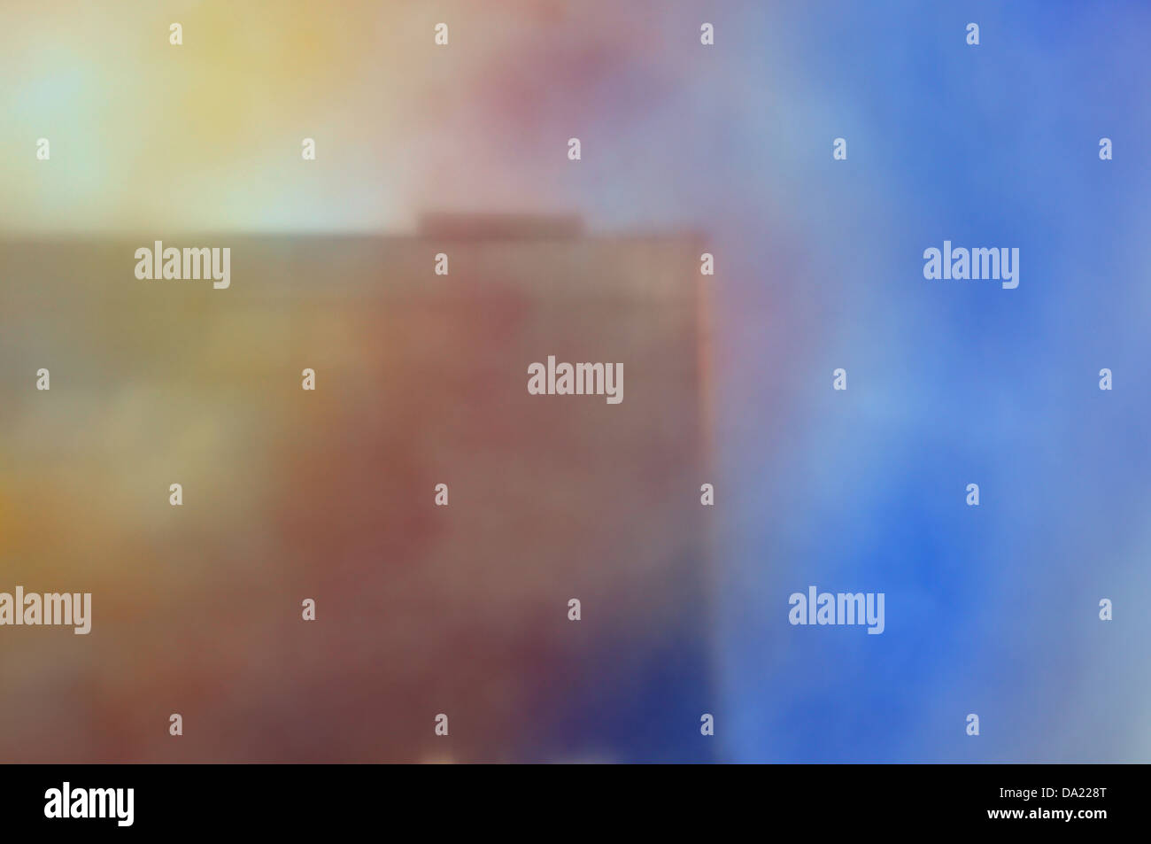 Blurry building exterior through colorful smudged glass. Architecture ...