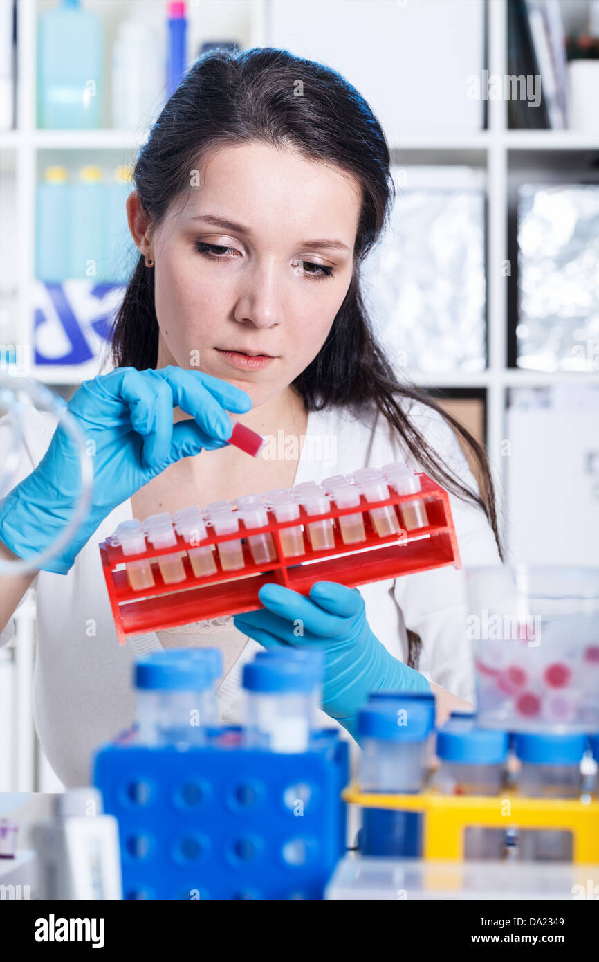 Woman with samples test tube Stock Photo - Alamy