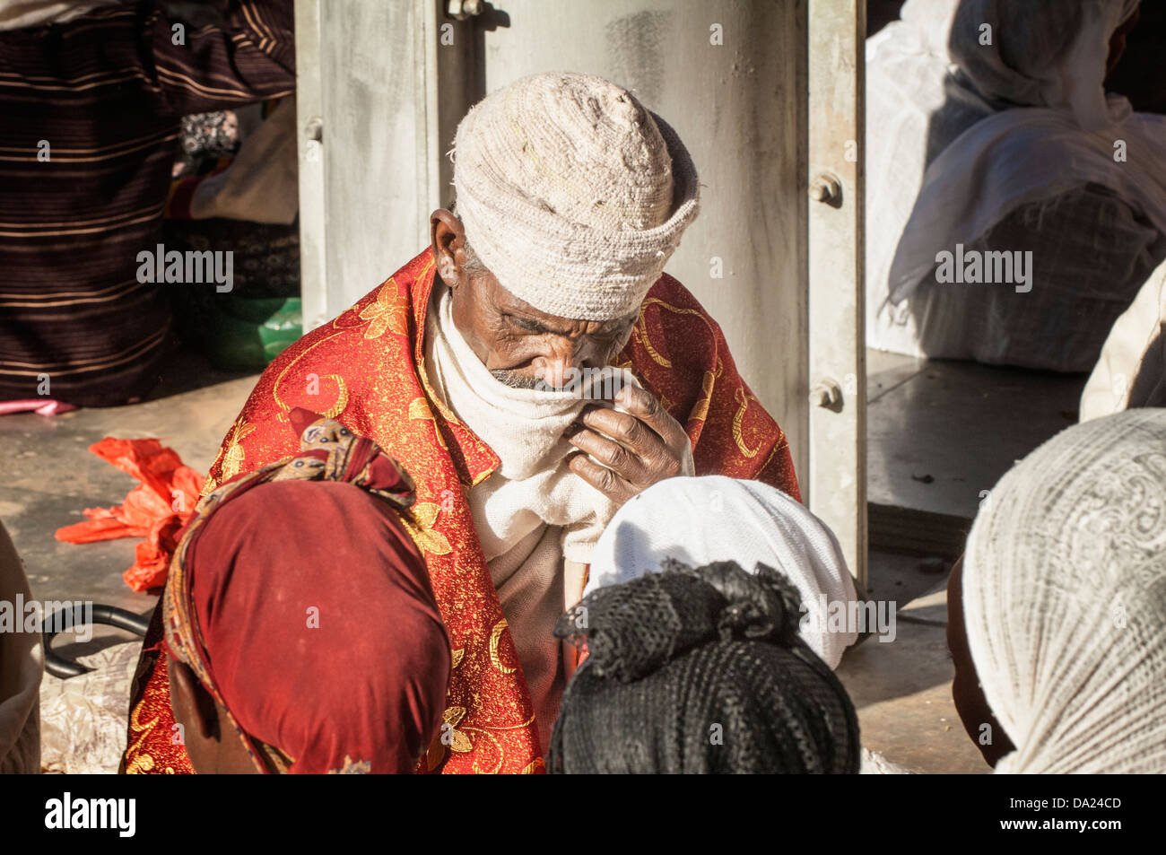 Priest holding relics from the Bete Medhane Alem Church, Lalibela ...