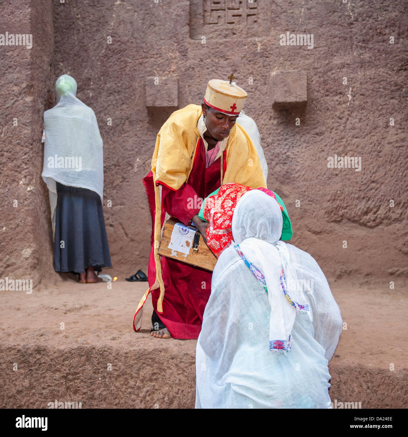 Priest holding relics from the Bete Medhane Alem Church, Lalibela ...
