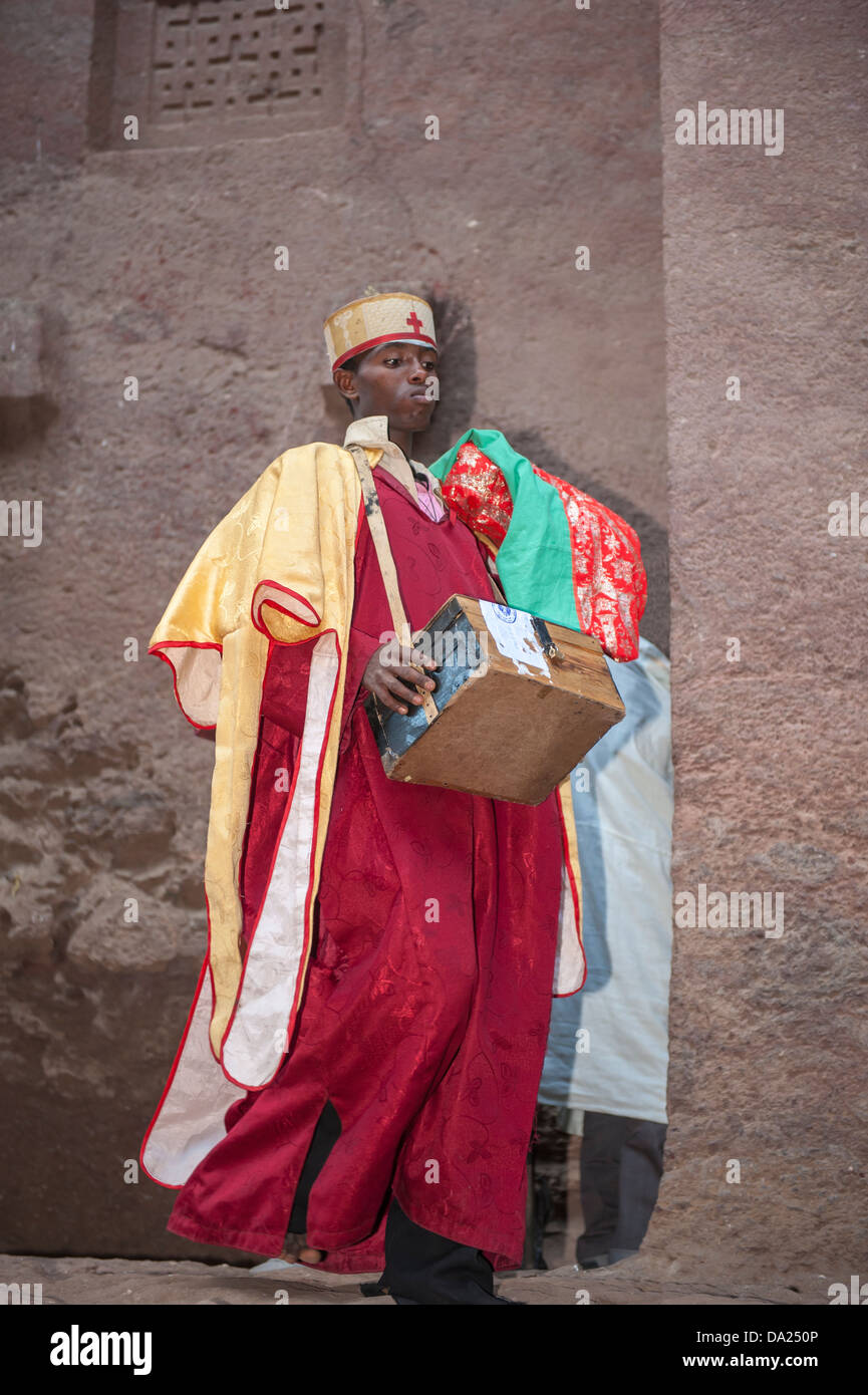 Priest holding relics from the Bete Medhane Alem Church, Lalibela ...