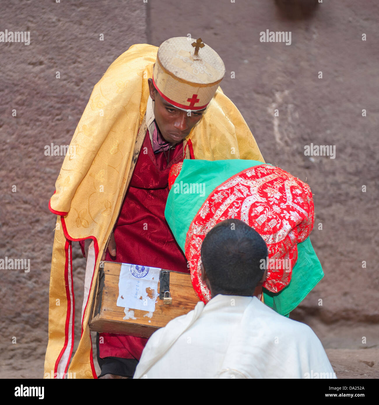 Priest holding relics from the Bete Medhane Alem Church, Lalibela ...
