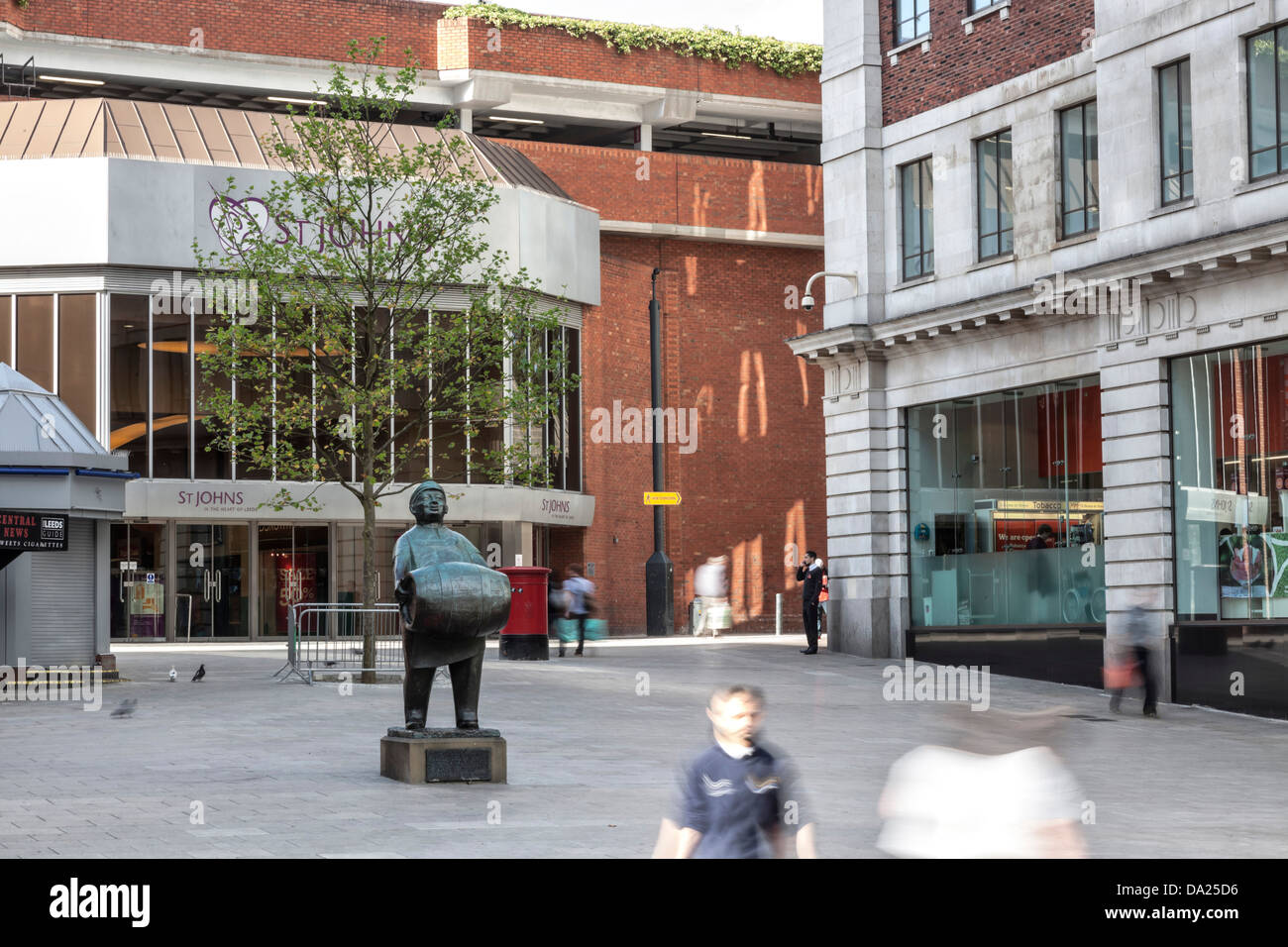 Long exposure of front of St. John's shopping centre center with statue ...