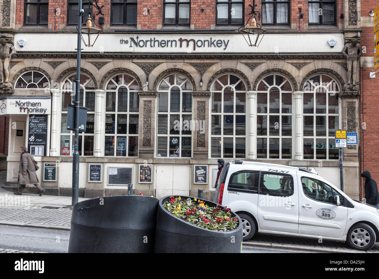 A taxi is parked outside the Northern Monkey pub in the middle of Leeds ...