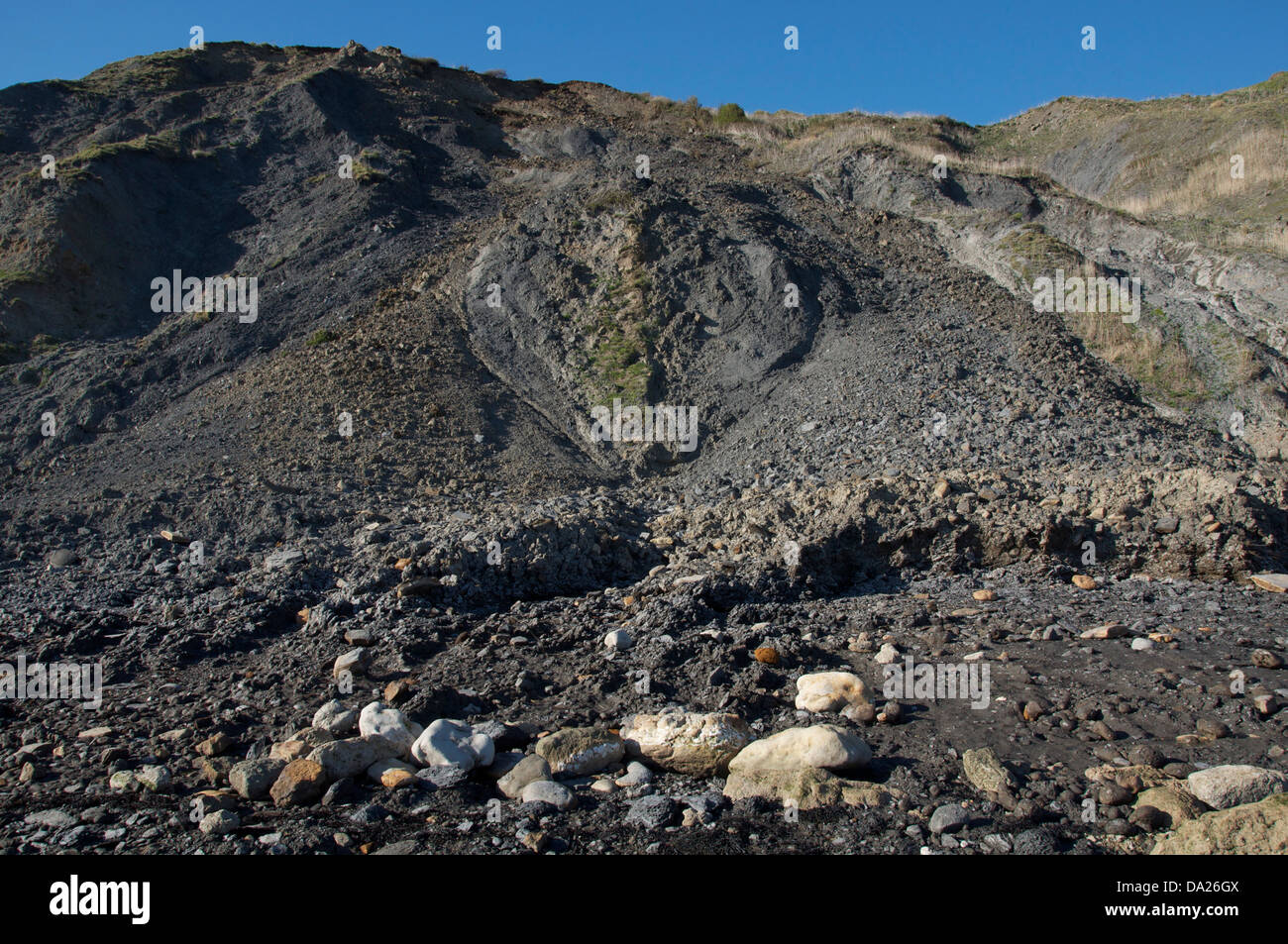 A scree of mudslide debris from a collapsed cliff at Black Head near ...