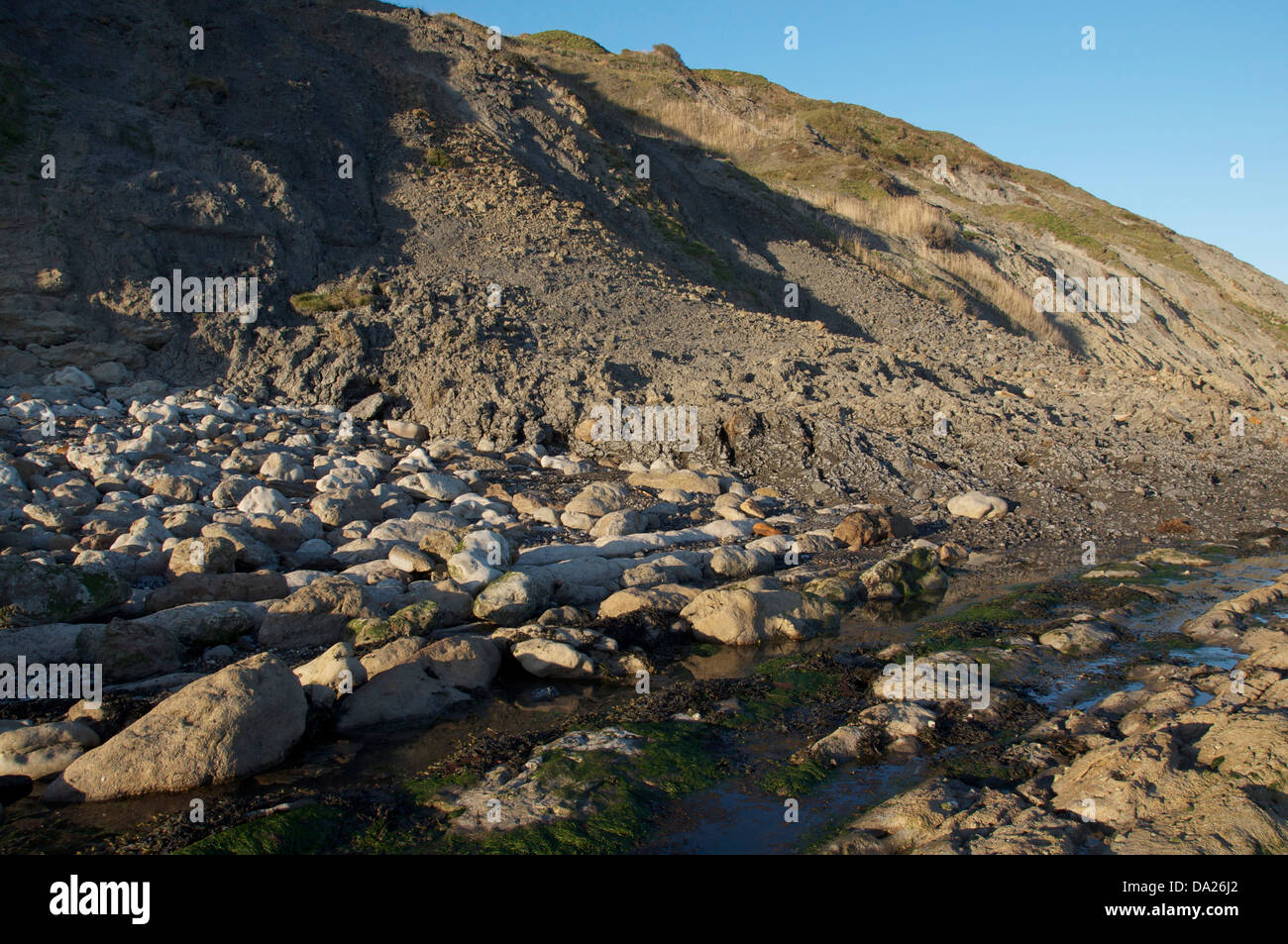 A scree of mudslide debris from a collapsed cliff at Black Head near ...