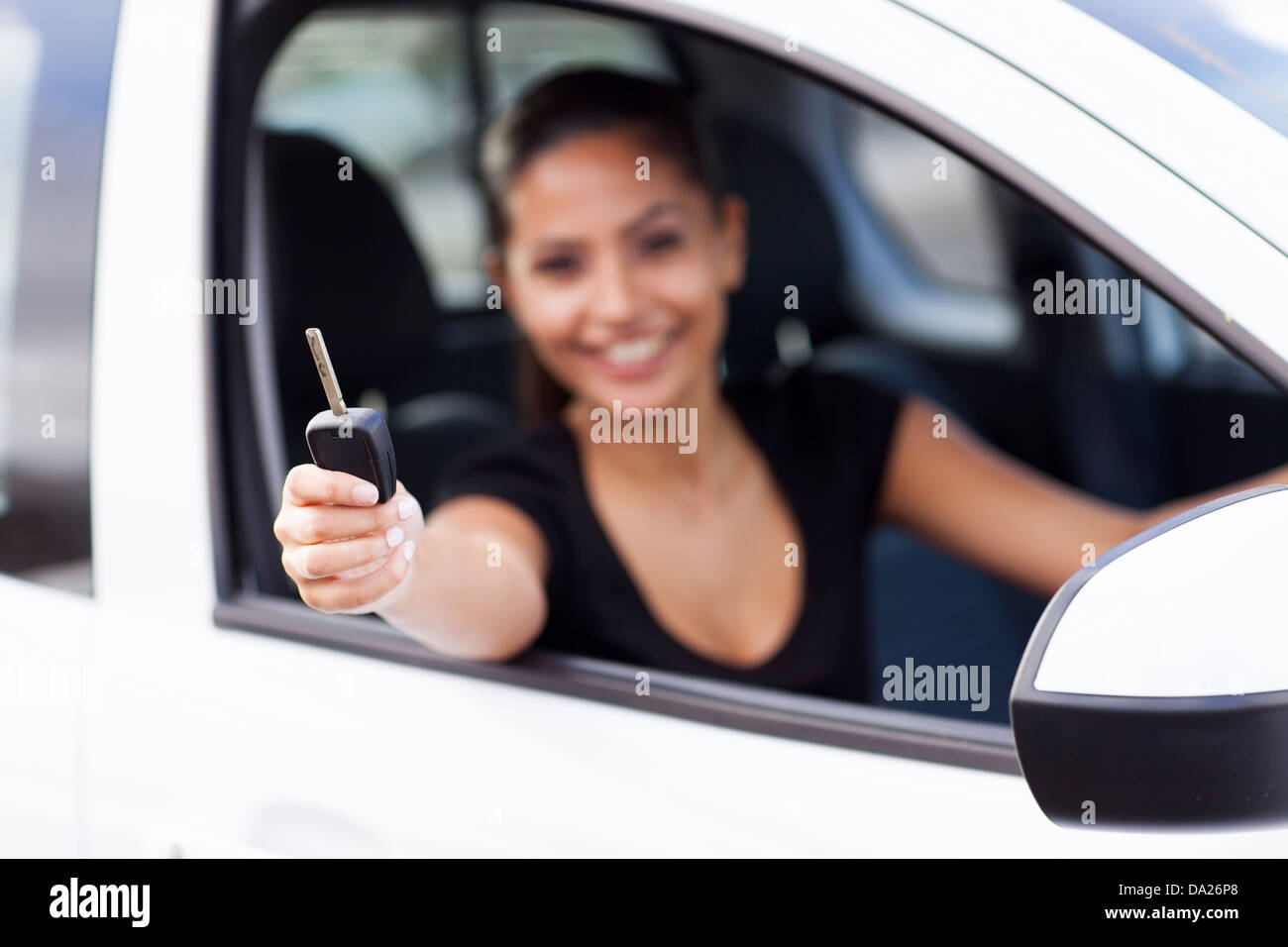 pretty woman showing car key inside new vehicle Stock Photo - Alamy