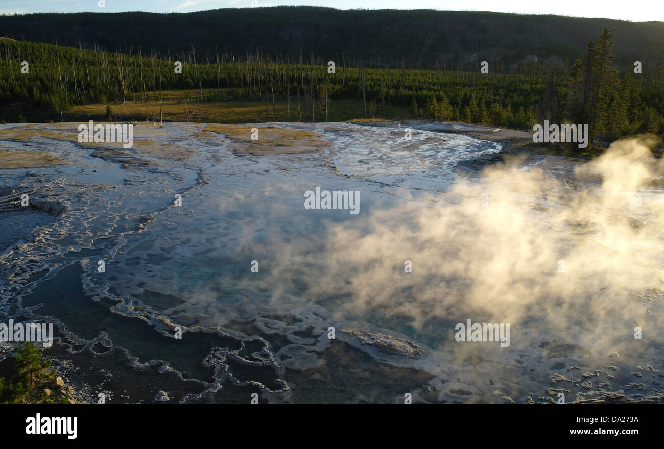 Sunset view overflow streams flowing Firehole River, sun shining steam ...