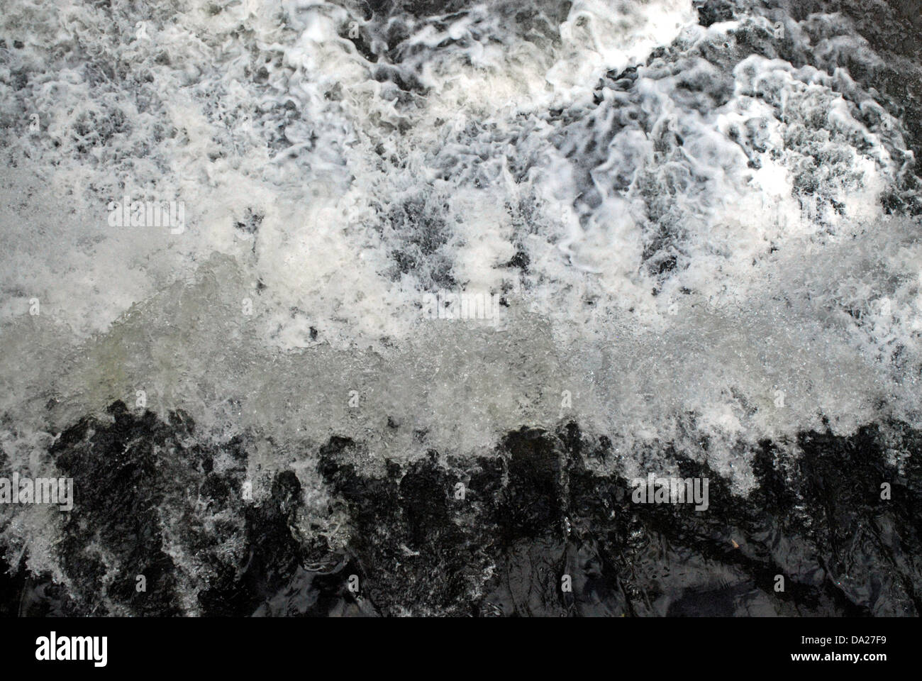 Water churning and foaming on waterfall Stock Photo - Alamy