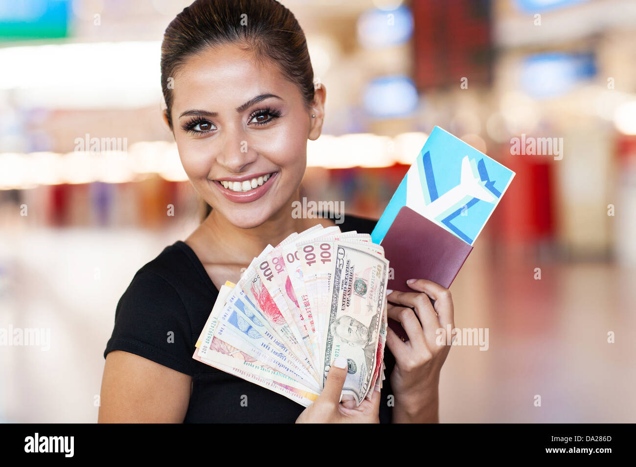 Beautiful Young Woman Holding Passport Air Ticket And Cash At Airport