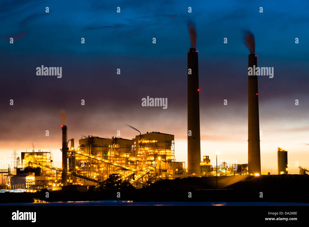 A coal power plant lit up at night Stock Photo - Alamy