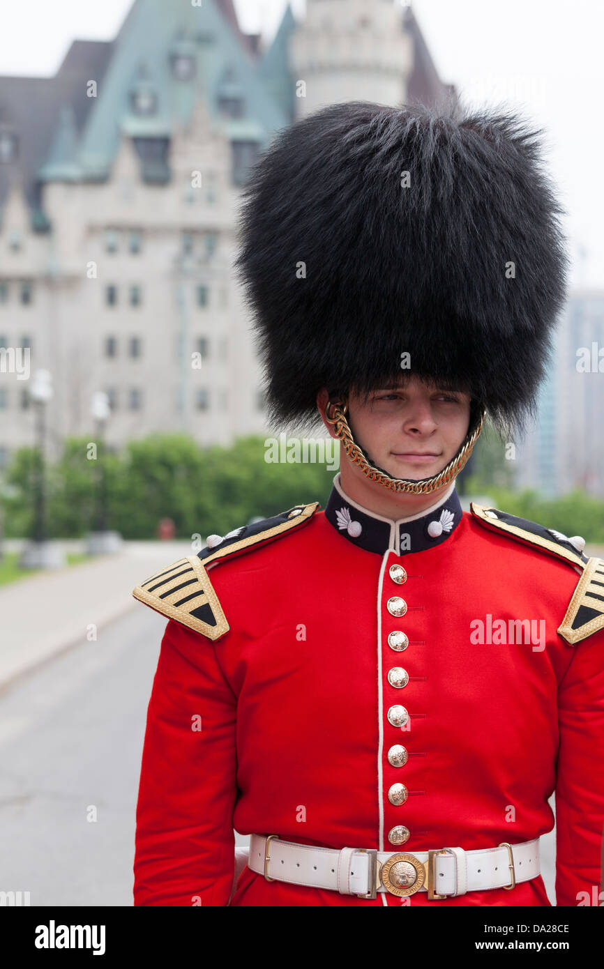 A Canadian honour guard poses for visitors during Canada Day ...