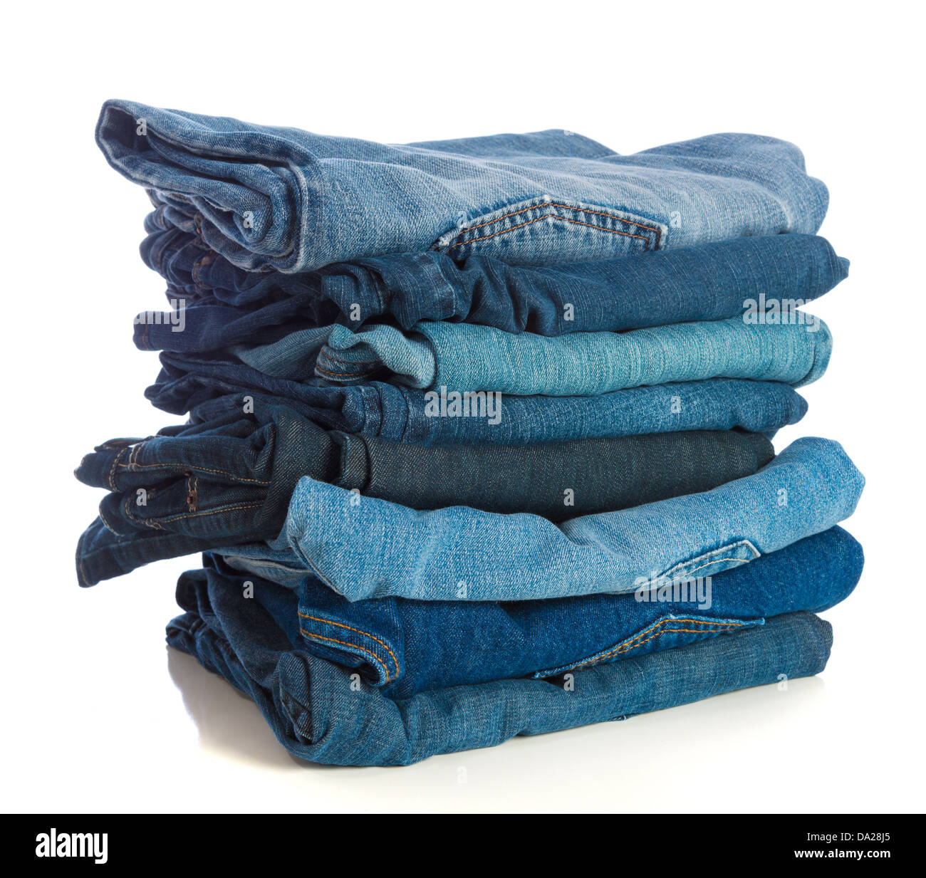 Stack of old blue jeans on a white background Stock Photo - Alamy
