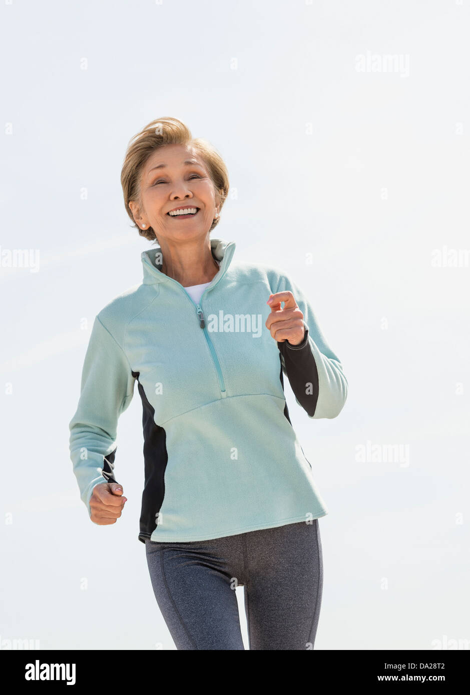 Senior woman jogging Stock Photo - Alamy