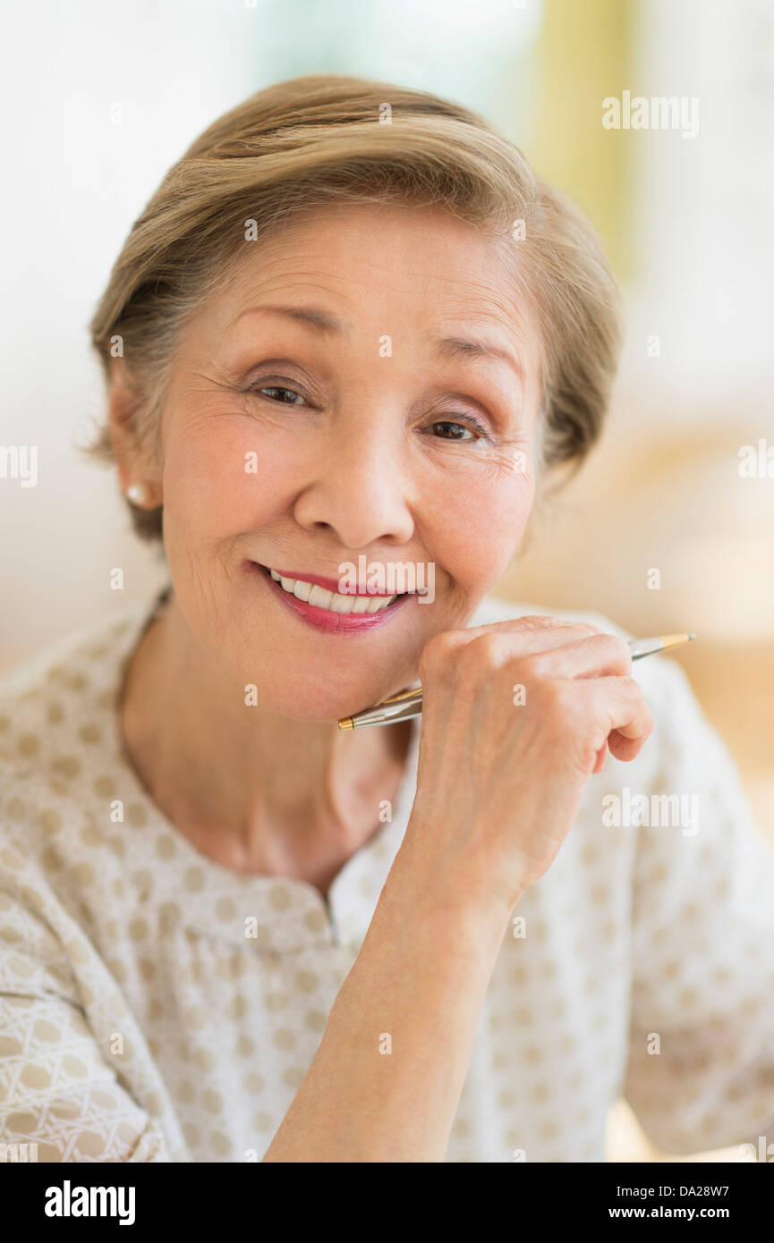 Portrait of senior woman smiling Stock Photo - Alamy